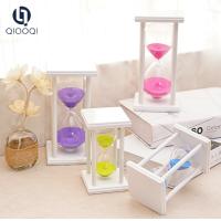 China Beautiful home and office decoration colorful hourglass with wooden frame for sale