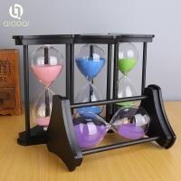 China High Quality Glass Colorful hourglass with three feet frame for sale for sale