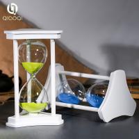 China High Quality Glass Colorful hourglass with three feet frame for sale for sale