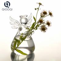 China Transparent OEM Logo Printing different glass vase for flowers for sale