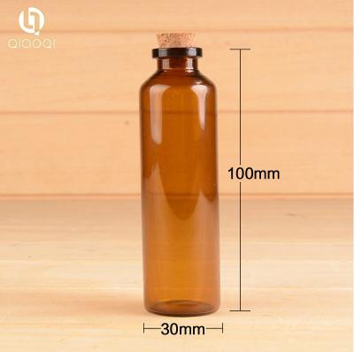 China 50ml brown color glass tube bottle with cork for sale