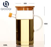 China kitchenware custom wholesale jar glass honey pot with handle glass oil dispenser for sale
