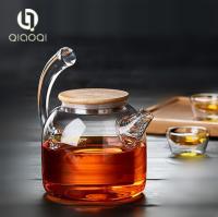 China high borosilicate glass teapot with handle and wooden lid for sale
