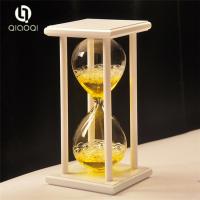 China factory direct glass bubble hourglass with wood frame at bottom price for sale