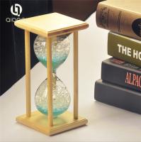 China factory direct glass bubble hourglass with wood frame at bottom price for sale