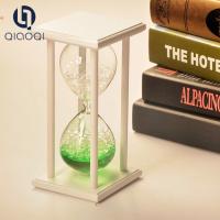 China factory direct glass bubble hourglass with wood frame at bottom price for sale