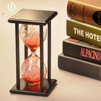 China factory direct glass bubble hourglass with wood frame at bottom price for sale
