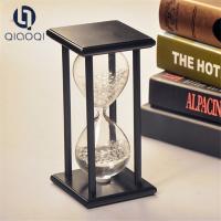 China factory direct glass bubble hourglass with wood frame at bottom price for sale