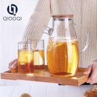 China Best selling decorative cool water jug hand blown 1.8L eco-design borosilicate glass tea pitcher kettles with bamboo lid for sale