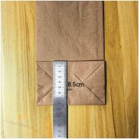 China Die-Cut Handle Kraft Paper Bag – D-Shaped Cut-Out Handle, Square Bottom, 80-140gsm for sale