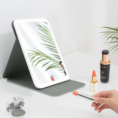 China Trendy Led PU Leather IPad Makeup Mirror Standing Led Lighted Mirror Portable For Travel for sale