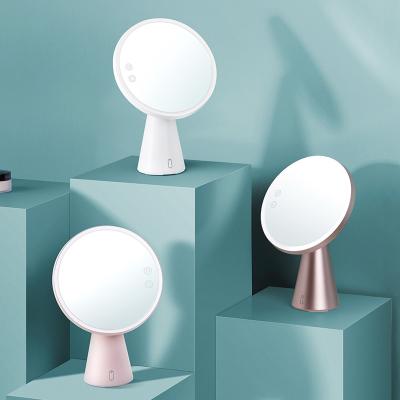 China Wholesale Desktop Folding Make up Mirror Portable Round Three Light Source Smart Table LED Luminous Makeup Mirror for sale