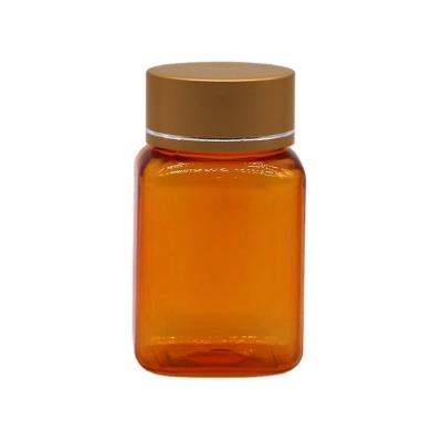 China 90ml 3oz PET Square Pill Bottle Yellow Orange with Rose Gold Cap Heat Seal for sale