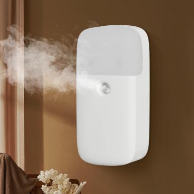 China 101–200 mL Capacity Electric Air Aroma Diffuser Wall Mounted Essential Oil Fragrance Machine for Household Hotel Elegant for sale