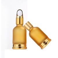 China Luxury Gold Dropper Frosted Glass Essential Oil Bottle Round Shape for sale