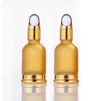 China Luxury Gold Dropper Frosted Glass Essential Oil Bottle Round Shape for sale