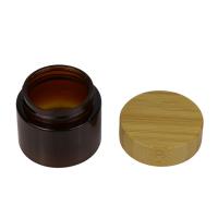 China Empty Cosmetic PET Cream Jar 50g 100g Plastic Container With Wooden Lid for sale