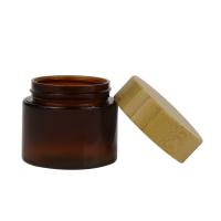China Empty Cosmetic PET Cream Jar 50g 100g Plastic Container With Wooden Lid for sale