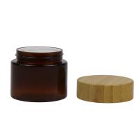 China Empty Cosmetic PET Cream Jar 50g 100g Plastic Container With Wooden Lid for sale