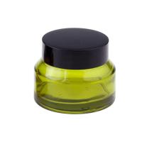 China IS09001 Glass Face Cream Jars Clear Olive Green Glass Cylinder Jars With Lids for sale