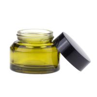 China IS09001 Glass Face Cream Jars Clear Olive Green Glass Cylinder Jars With Lids for sale