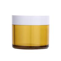 China SGS 120g 150g Cosmetic Yellow Glass Jar Round Glass Canister With Lid for sale