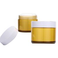 China SGS 120g 150g Cosmetic Yellow Glass Jar Round Glass Canister With Lid for sale