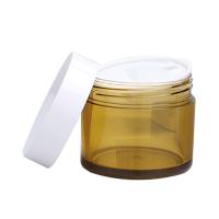 China SGS 120g 150g Cosmetic Yellow Glass Jar Round Glass Canister With Lid for sale