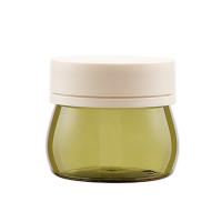 China 30g 50g 80g 100g Cosmetic Clear Green Glass Jar With Plastic Lid For Body Cream for sale