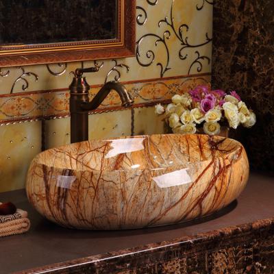 China Luxury Ceramic Countertop Bathroom Sink 600x400x155 mm Modern Marble Wash Basin for Hotel for sale