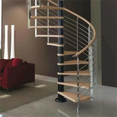 China Indoor Space Saving Spiral Staircase Wood Tread 800-1500mm Stainless Steel 76-114mm for sale