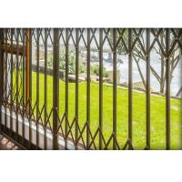 China Durable Aluminum Concertina Grille Sliding Window with Burglar Bars Custom Size for sale
