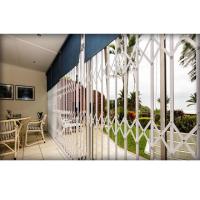 China Durable Aluminum Concertina Grille Sliding Window with Burglar Bars Custom Size for sale
