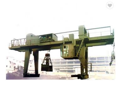 China Cabin Control Double Girder Gantry Crane Rail Traveling Grapple Or Bucket Portal Crane for sale