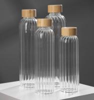 China IKOO BPA-Free Reusable Glass Water Bottle with Leak-proof Airtight Lid and Dishwasher Safe Borosilicate Glass Bottle for Gym and Office for sale