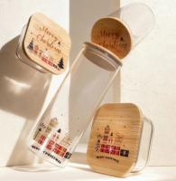 China IKOO Festival Design Glass Canister with Airtight Bamboo Lid and Multiple Sizes for Kitchen Storage for sale