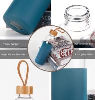 China 600ml BPA-Free Leak-Proof Borosilicate Glass Water Bottle with Bamboo Lid and Silicone Sleeve for sale