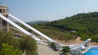 China Customized Water Theme Park Equipment High Speed Water Slide And Bouncer for sale
