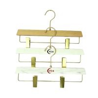 China Gold-plated non-slip plastic trouser clips with customizable color and logo for hotels and clothing stores for sale