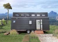 China Cost Of Ready-Made Steel Frame Prefab Tiny House On Wheels With Trailer for sale