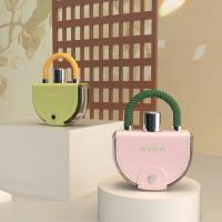 China 100ml Glass Perfume Bottles Handbag Shaped Leather Rope Handle Spray Empty for sale