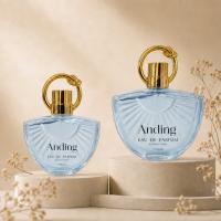 China 50ml 100ml Glass Perfume Bottle Unique Ring Cap Handbag Style Empty Spray for sale