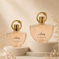 China 50ml 100ml Glass Perfume Bottle Unique Ring Cap Handbag Style Empty Spray for sale