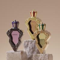 China 100ml Glass Perfume Bottles Unique Crown Cap Shield Shape Spray Crimp Neck Empty for sale