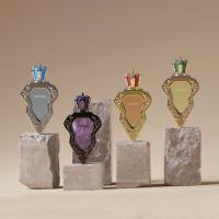 China 100ml Glass Perfume Bottles Unique Crown Cap Shield Shape Spray Crimp Neck Empty for sale