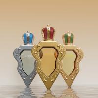 China 100ml Glass Perfume Bottles Unique Crown Cap Shield Shape Spray Crimp Neck Empty for sale