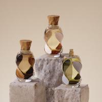 China 100ml Glass Perfume Bottles Unique Curved Design Flared Cap Empty Spray for sale