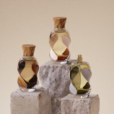 China 100ml Glass Perfume Bottles Unique Curved Design Flared Cap Empty Spray for sale