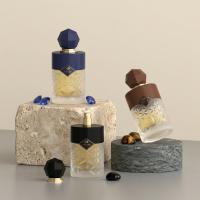 China 100ml Glass Perfume Bottles Unique Marble Pattern Geometric Cap Empty Spray for sale