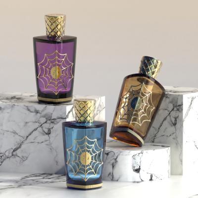 China 100ml Glass Perfume Bottles Empty Unique Spray Triangle Spider Web Metal Cap for sale